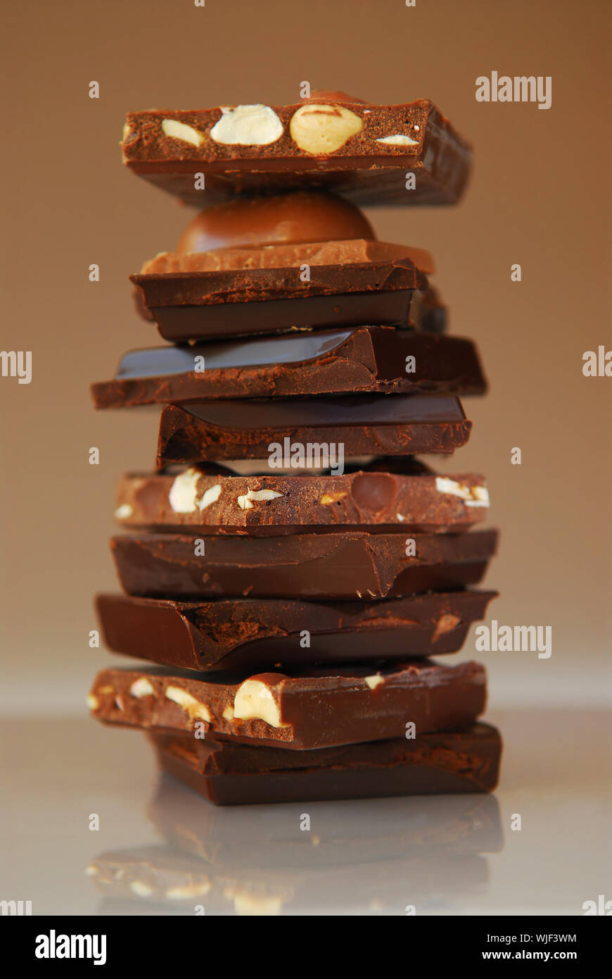 Stack of broken pieces of chocolate from assorted bars Stock Photo - Alamy