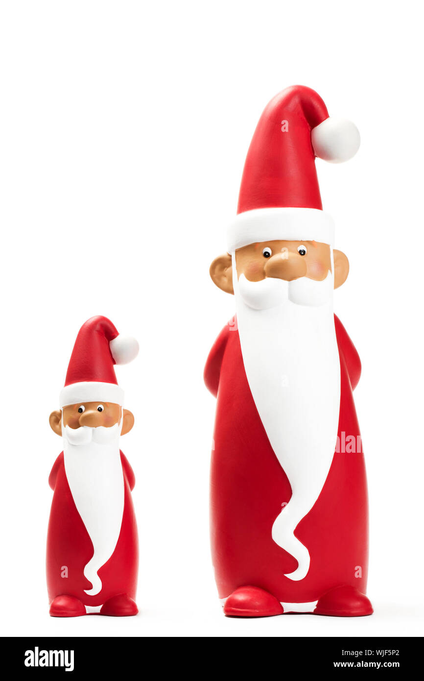 two slender santa figurines on white background Stock Photo - Alamy