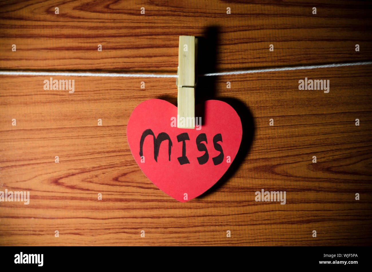 red heart word miss on wood vintage stlye background Stock Photo - Alamy