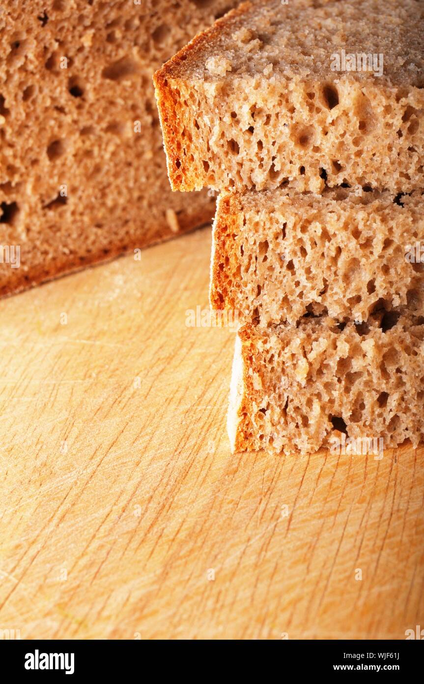 bread on wood surface showing food or bakery concept Stock Photo - Alamy