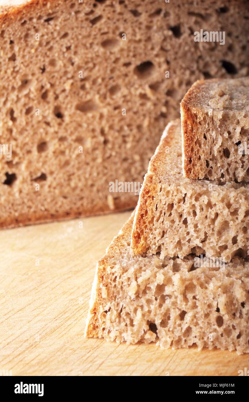 bread on wood surface showing food or bakery concept Stock Photo - Alamy