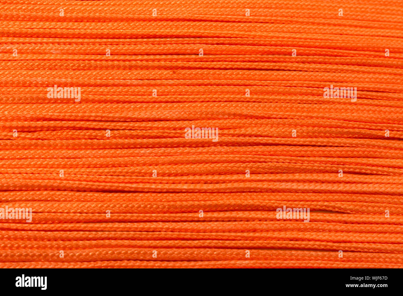 Macro close-up of braided orange polypropylene cord. Diam. approx. 2-3 ...