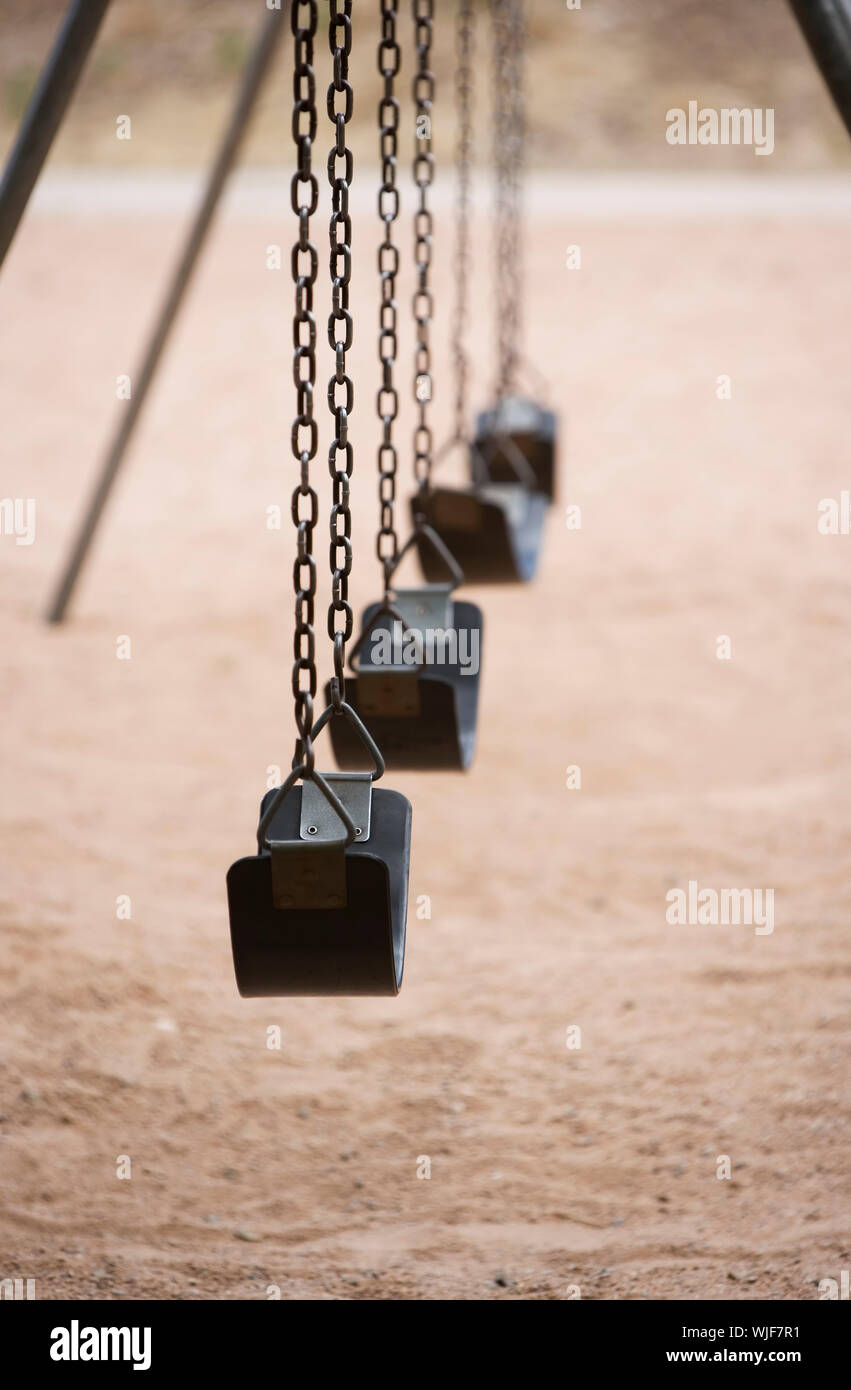 Old style playground swings with chains and rubber seats Stock Photo ...