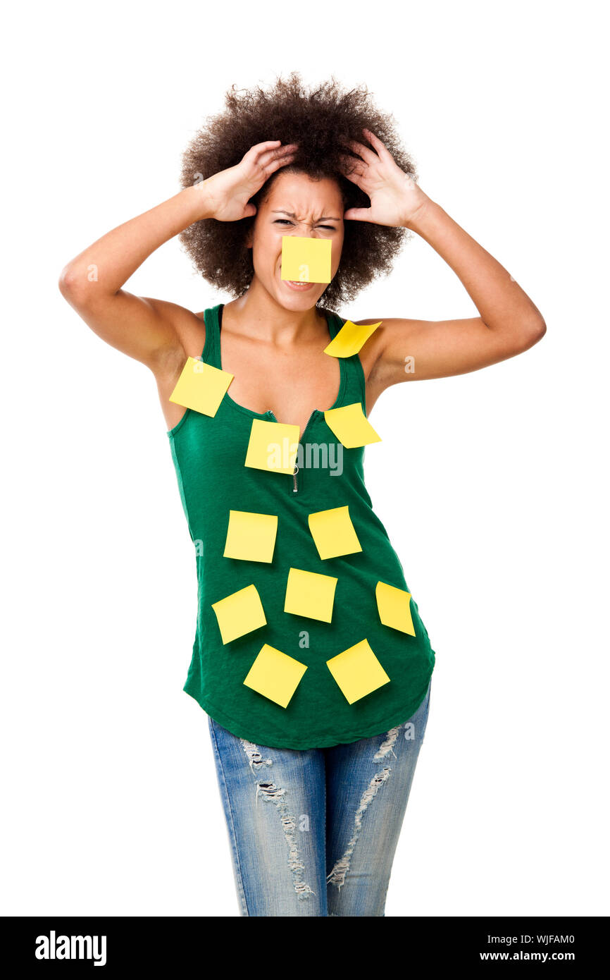 Beautiful young woman covered with post it notes all over the body ...