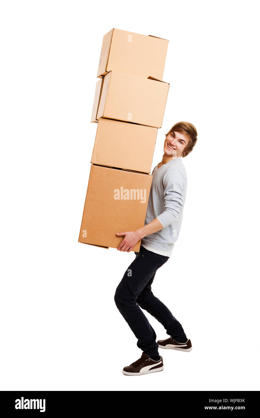 Portrait of a handsome young man holding card boxes, isolated on white ...