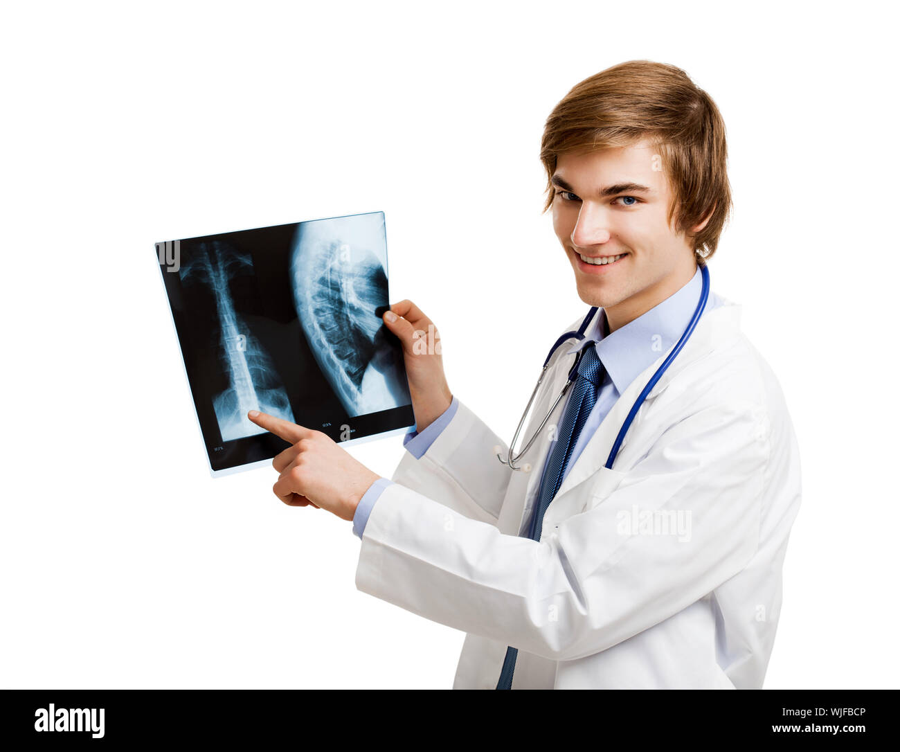 Portrait of a handsome doctor smiling holding a RX, isolated over a ...