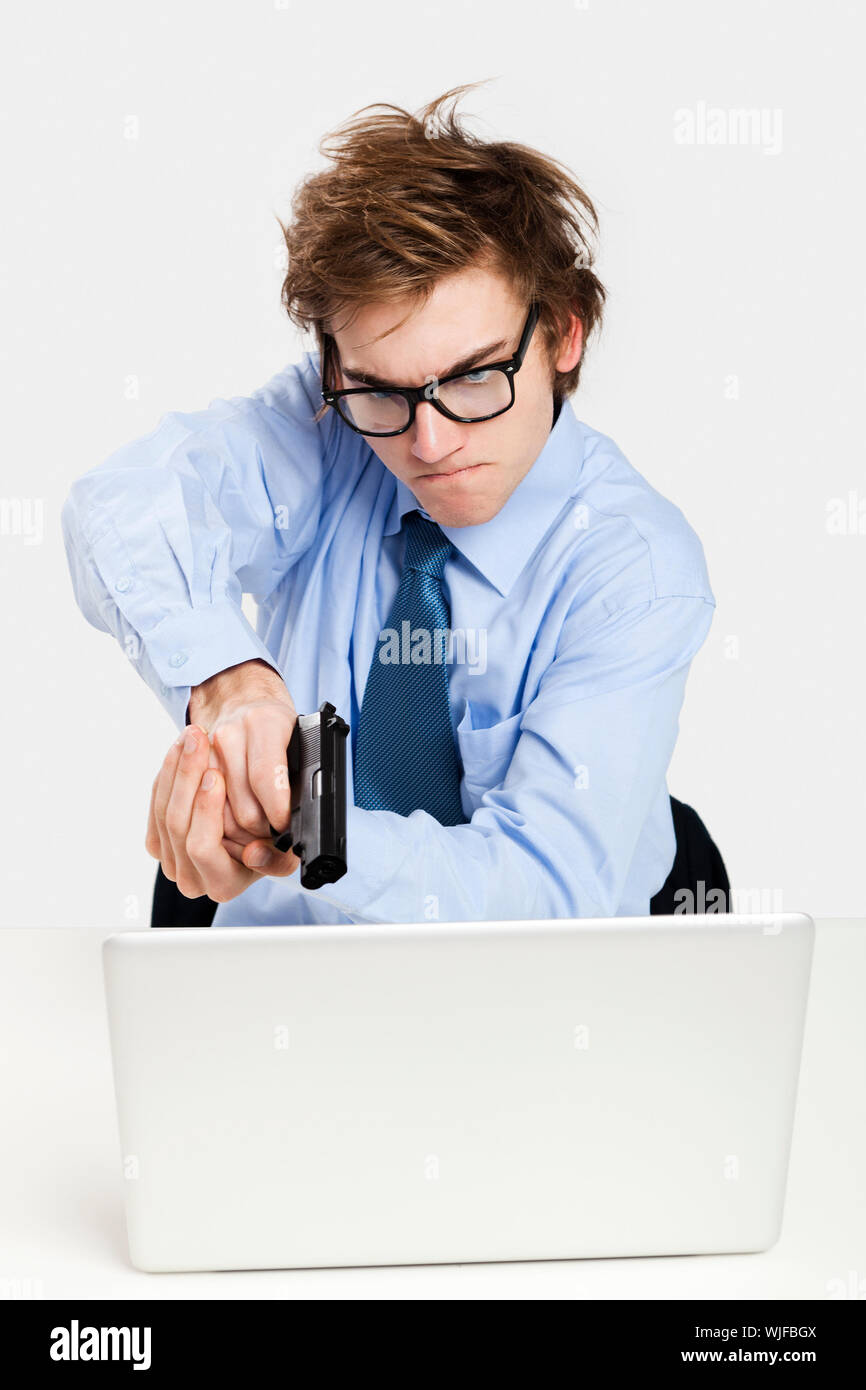 Pointing gun at computer hi-res stock photography and images - Alamy