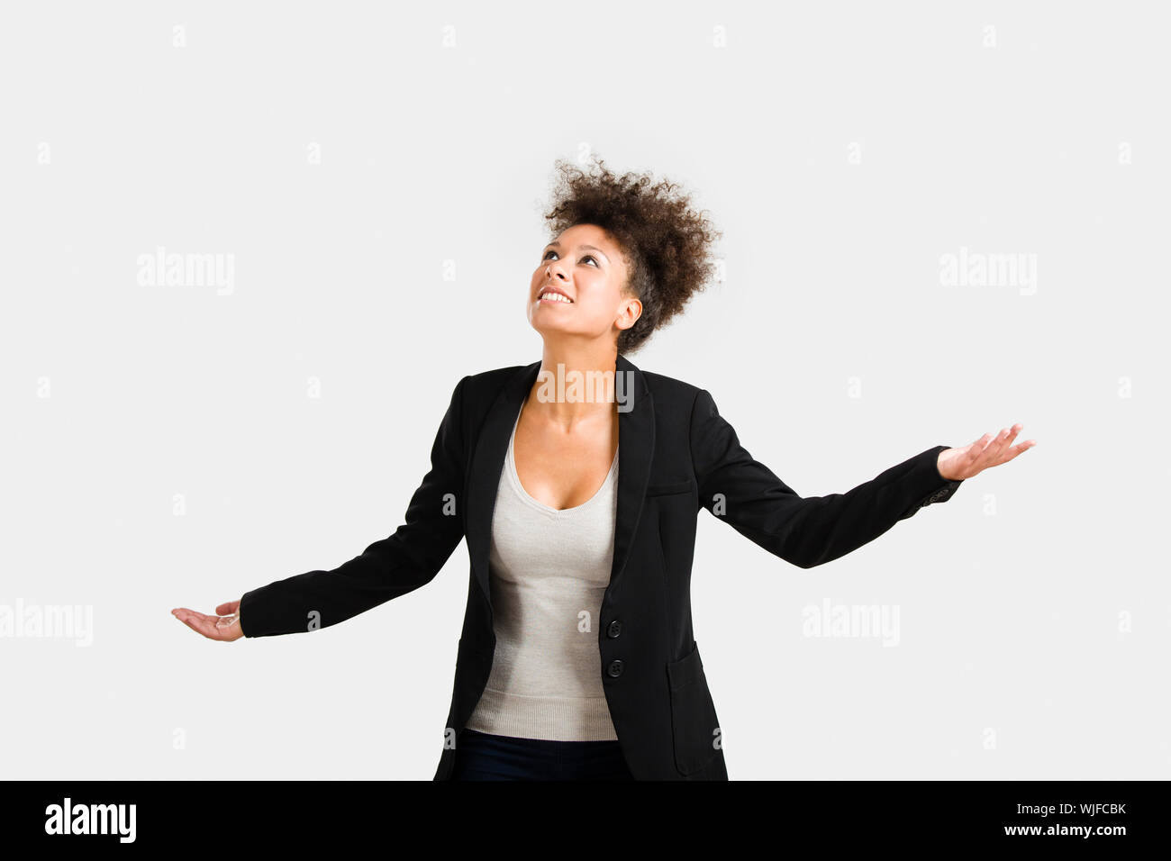 Business woman trying to catch something falling from the sky, isolated ...