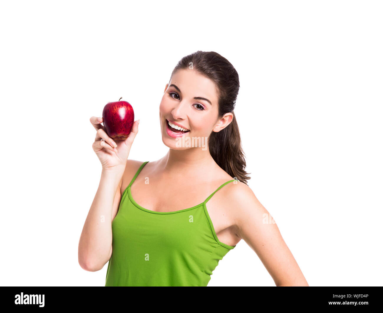 Healthy woman eating a fresh apple, isolated over a white background ...