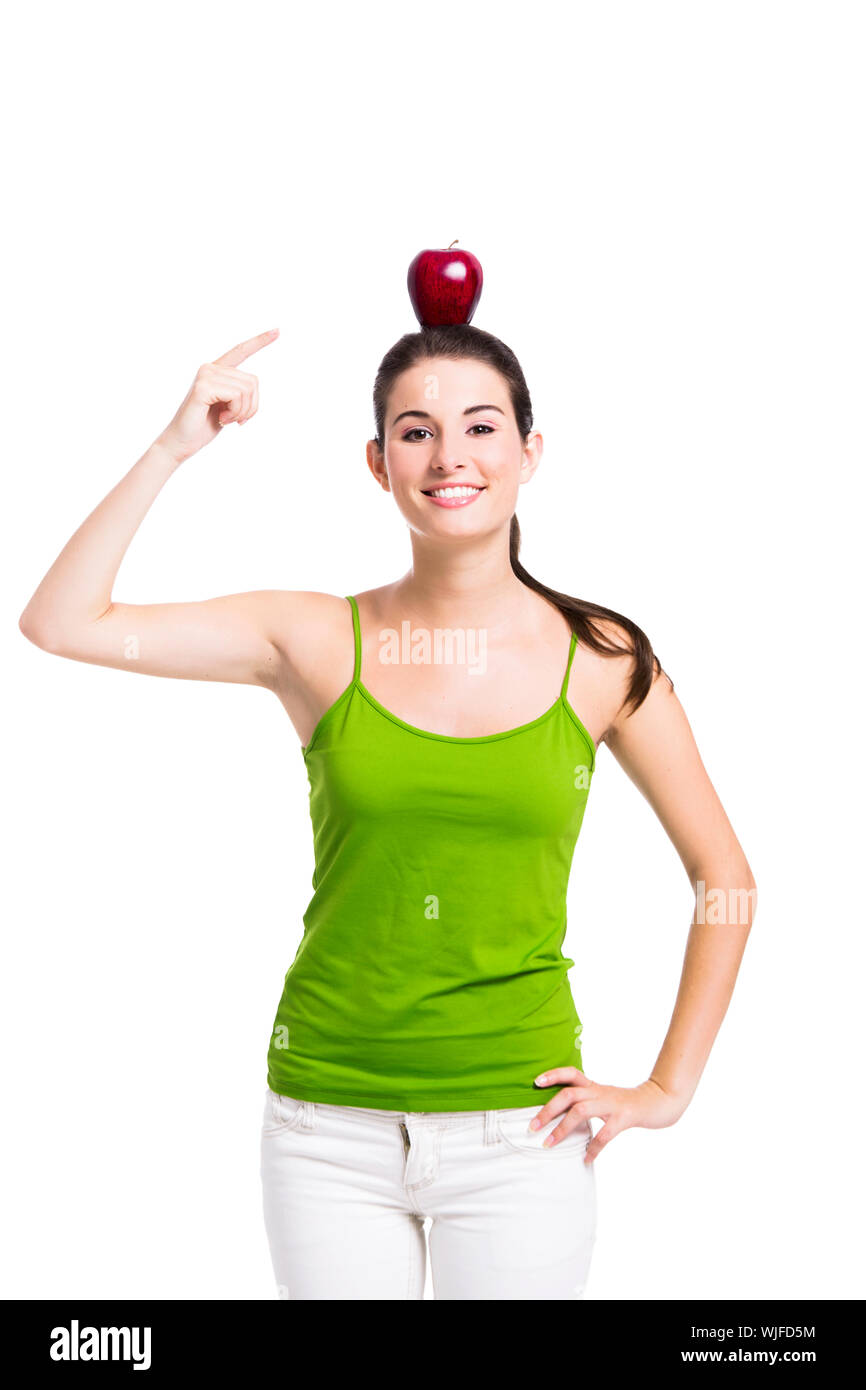 Healthy woman pointing to a apple over her head, isolated in white ...