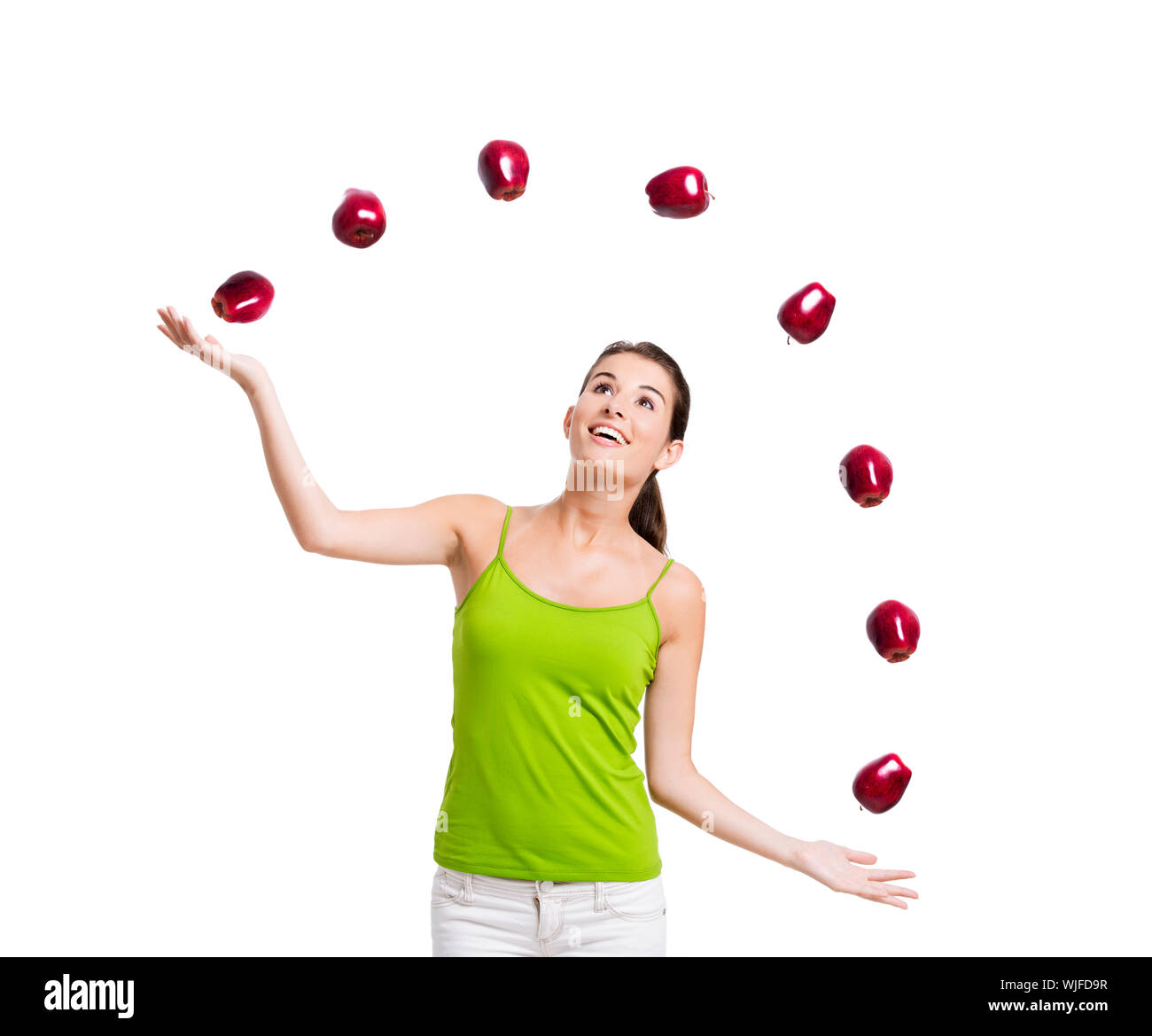 Healthy woman throwing apples, isolated over a white background Stock ...