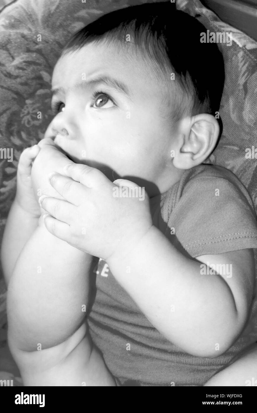 Boy lying bed feet Black and White Stock Photos & Images - Alamy