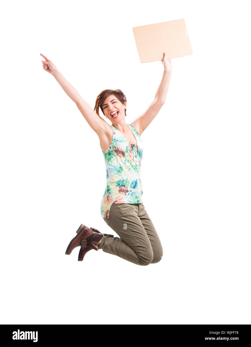 Beautiful and happy woman jumping and holding a cardboard, isolated ...
