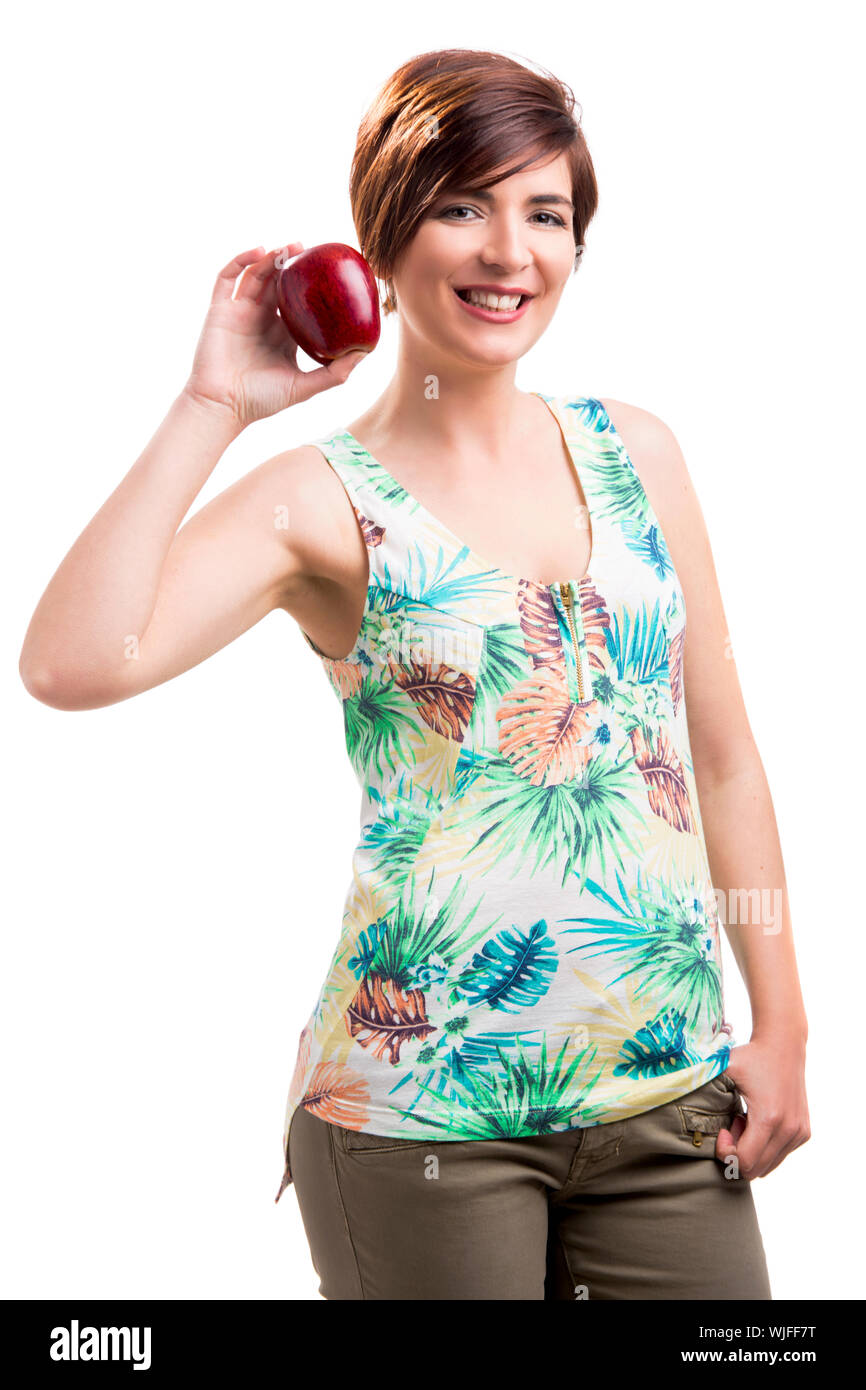 Beautiful woman holding a red apple, isolated over white background ...