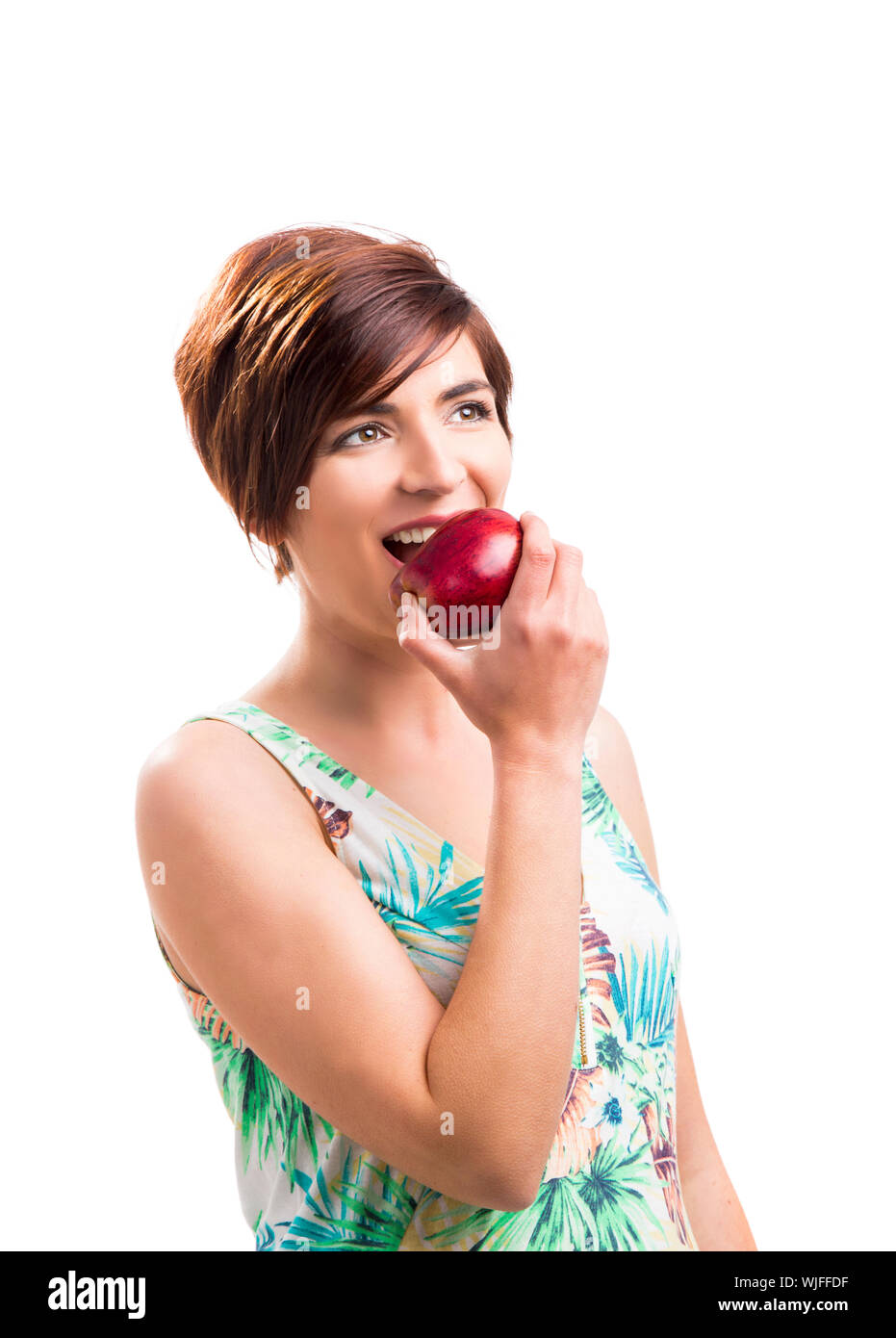 Beautiful woman eating an apple, isolated over white background Stock ...