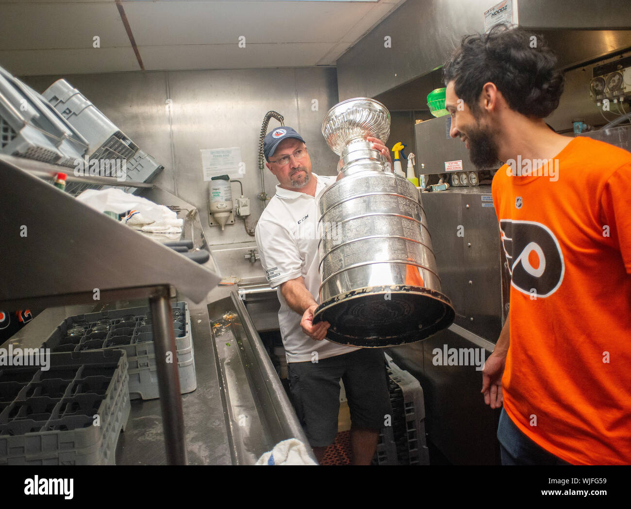 Stanley Cup Guard Walt Neubrand of Toronto carries the cup after ...