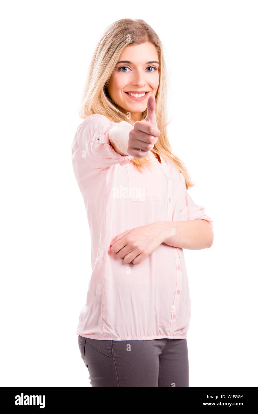 Beautiful young woman smiling with thumbs up, isolated over a white ...