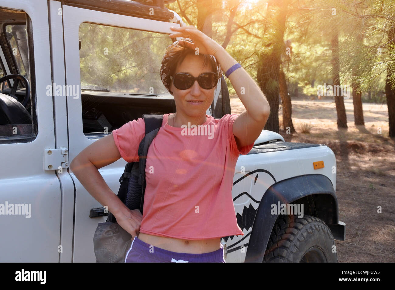 Beautiful young woman. SUV driving in the highlands. Tourism Stock ...