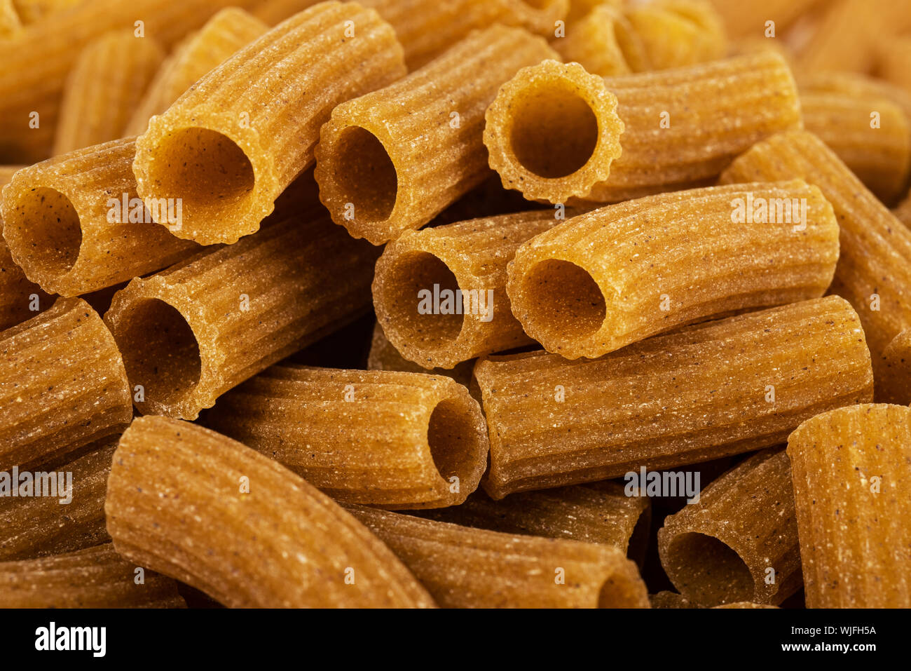 Rustic rigatoni pasta , food background Stock Photo - Alamy