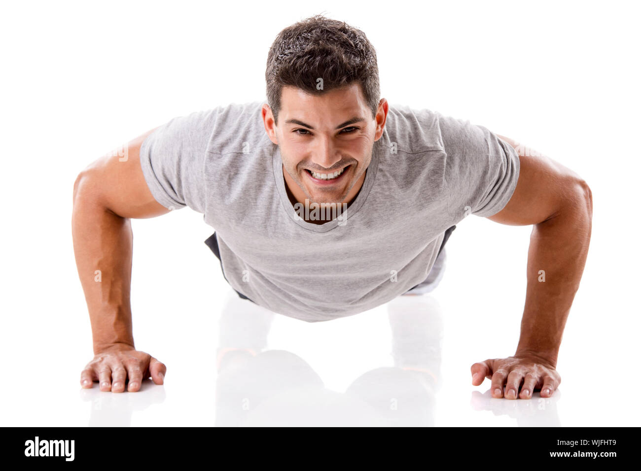 Man making pushups in studio, isolated over a white background Stock ...