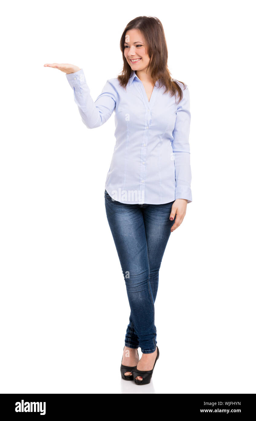 Beautiful woman smiling and showing the palm of her right hand ...