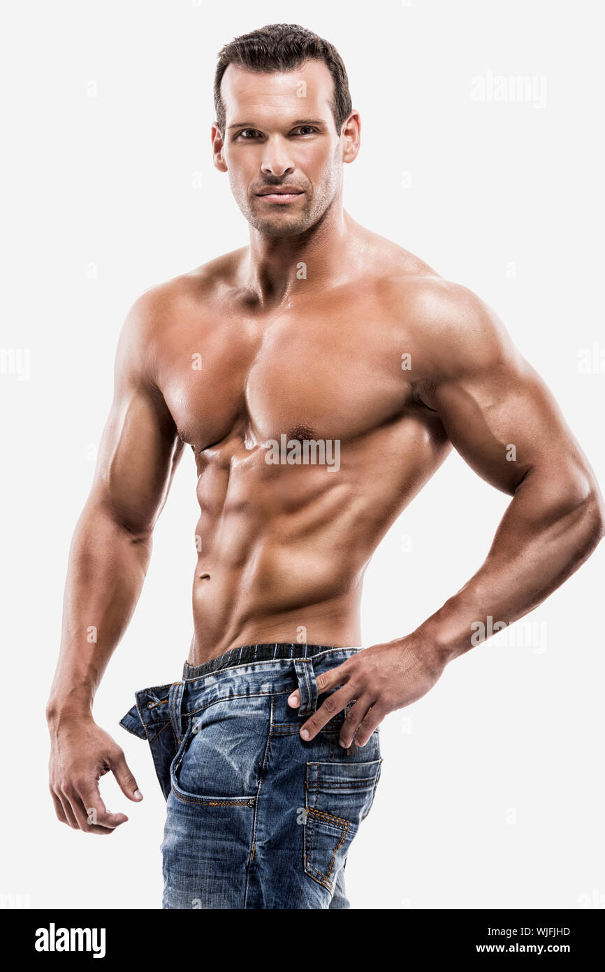 Muscle man posing in studio, isolated over a white background Stock ...