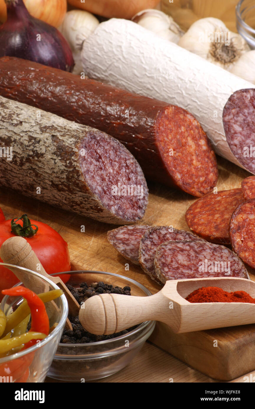 salami and some slices salami on a timber board Stock Photo - Alamy