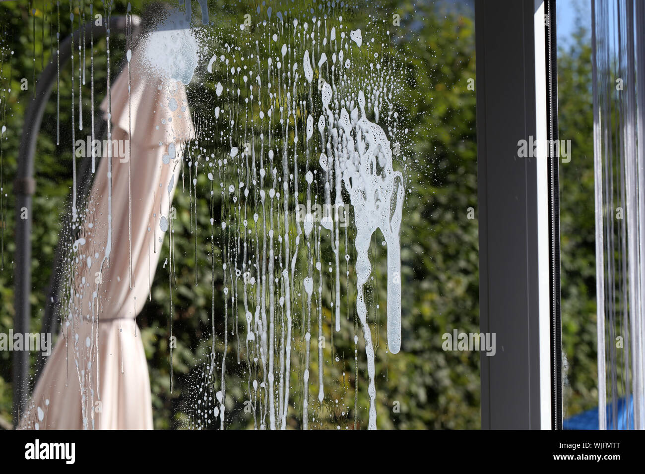 Cleaning concept. Woman washing window, close up Stock Photo - Alamy