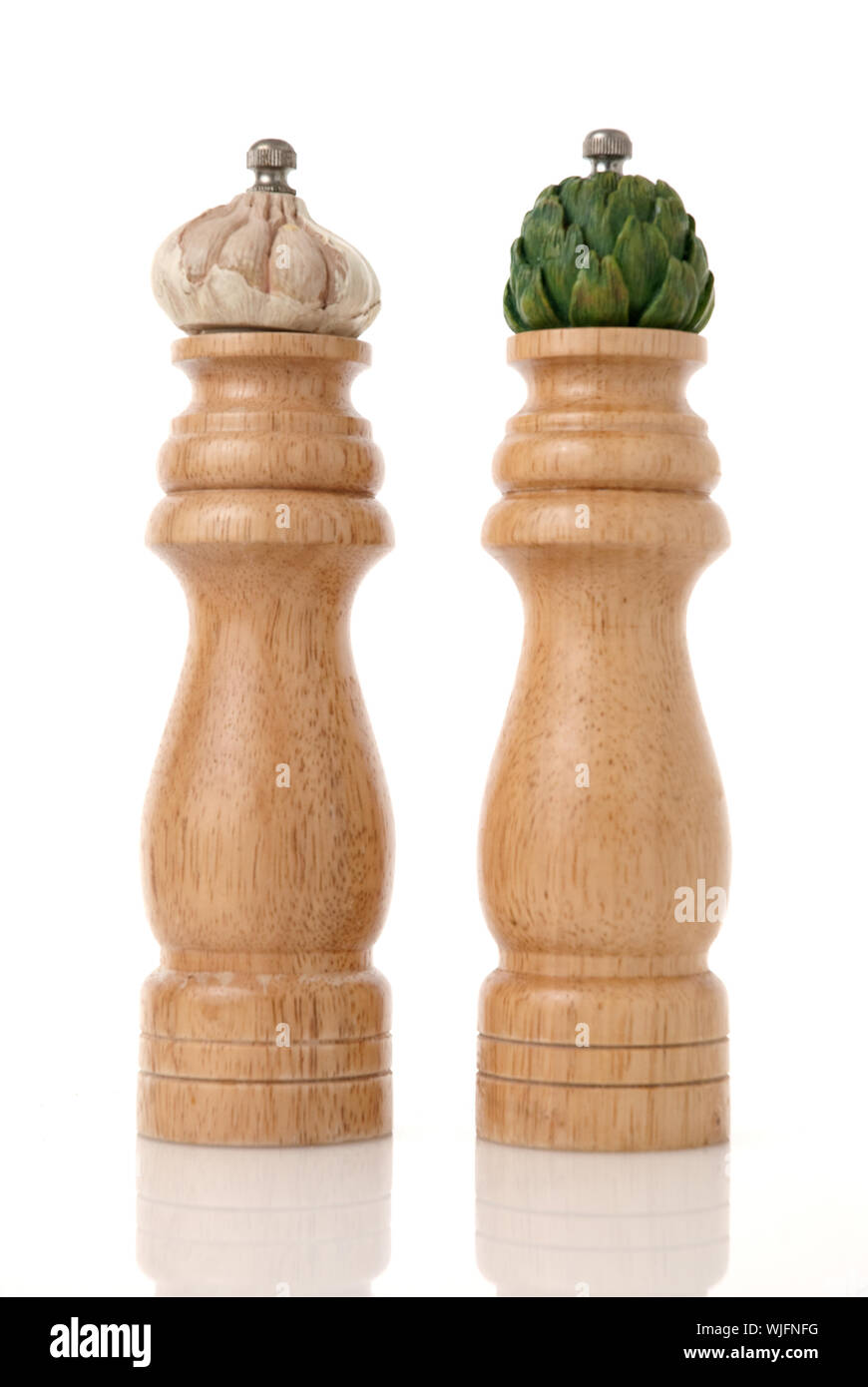 Stylish garlic and pepper condiment dispenser isolated on a white ...