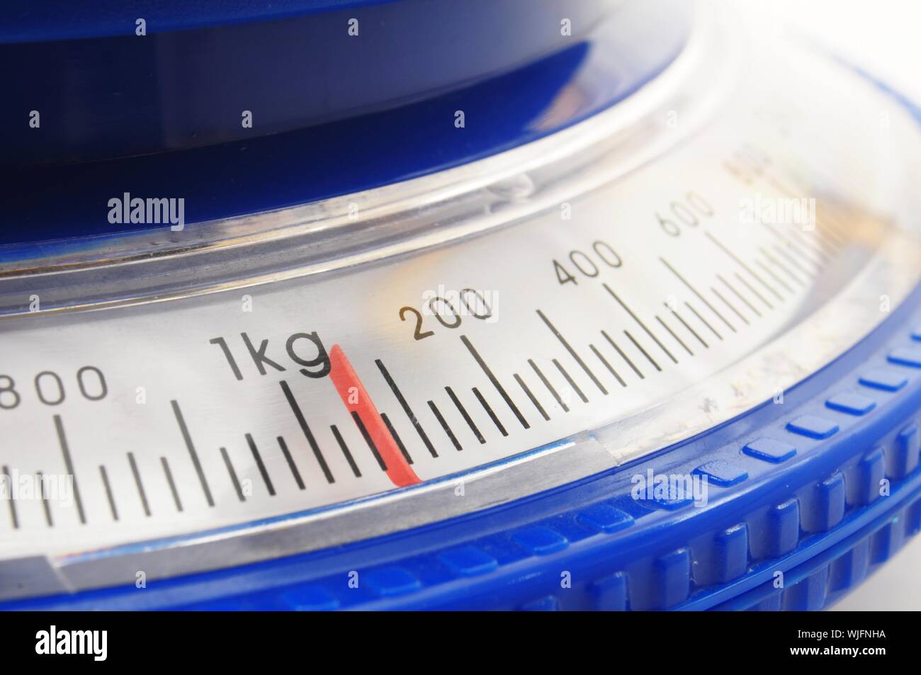 blue kitchen scales or balance showing cooking concept Stock Photo - Alamy