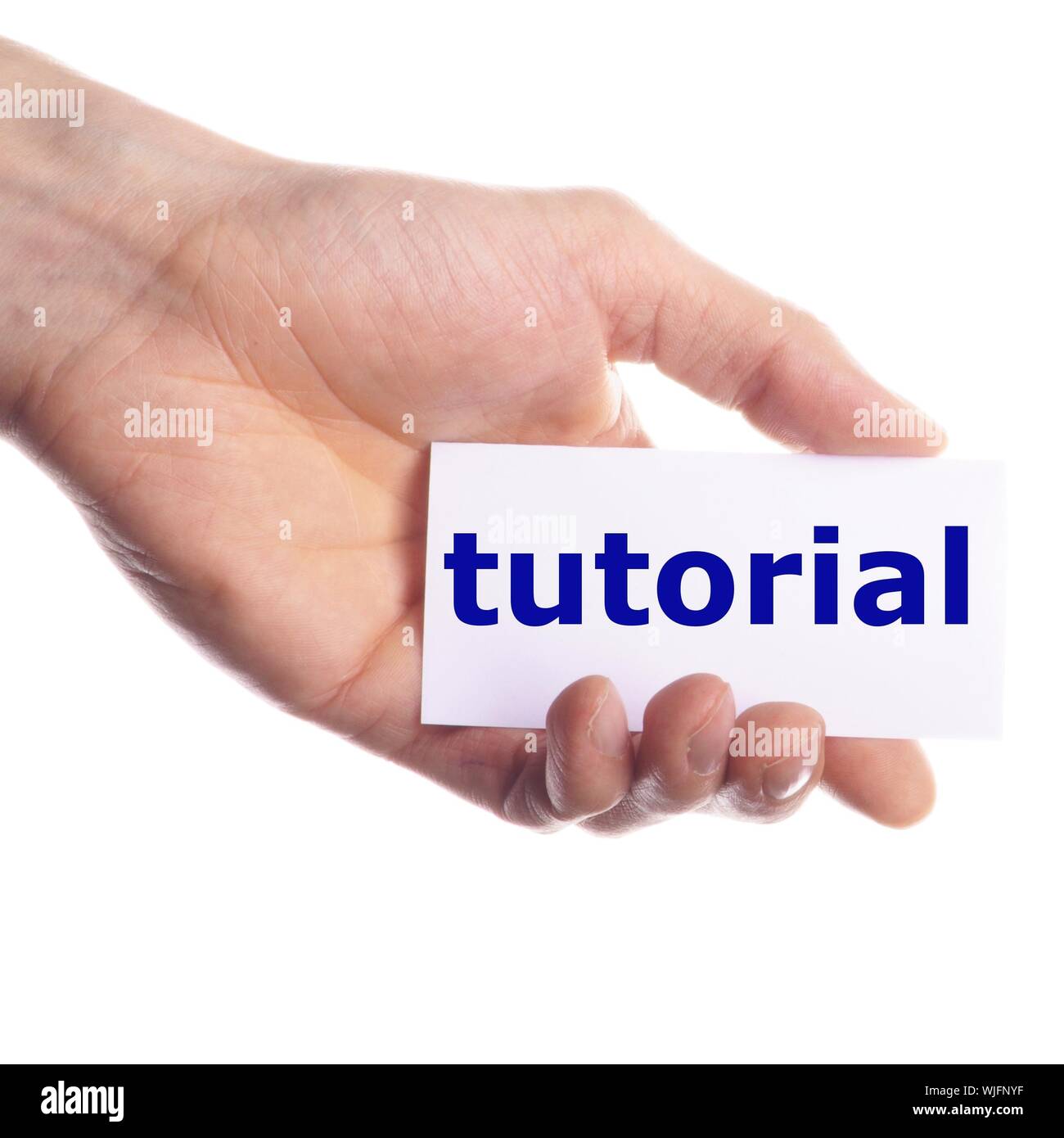 tutorial or howto concept with hand word an paper Stock Photo - Alamy