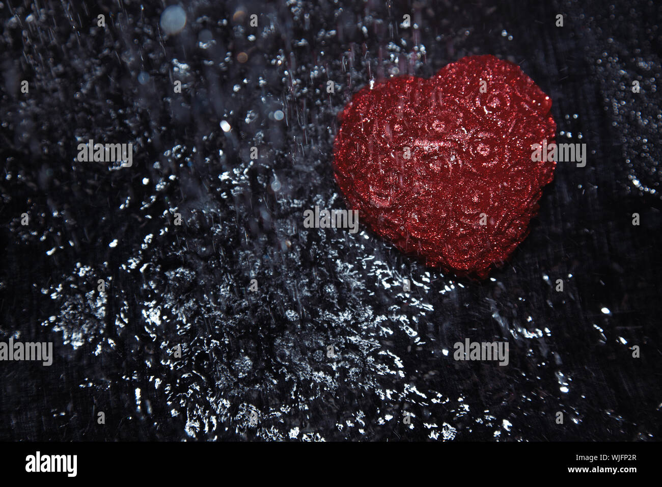 Heart shape in heavy rain. Close-up view Stock Photo - Alamy