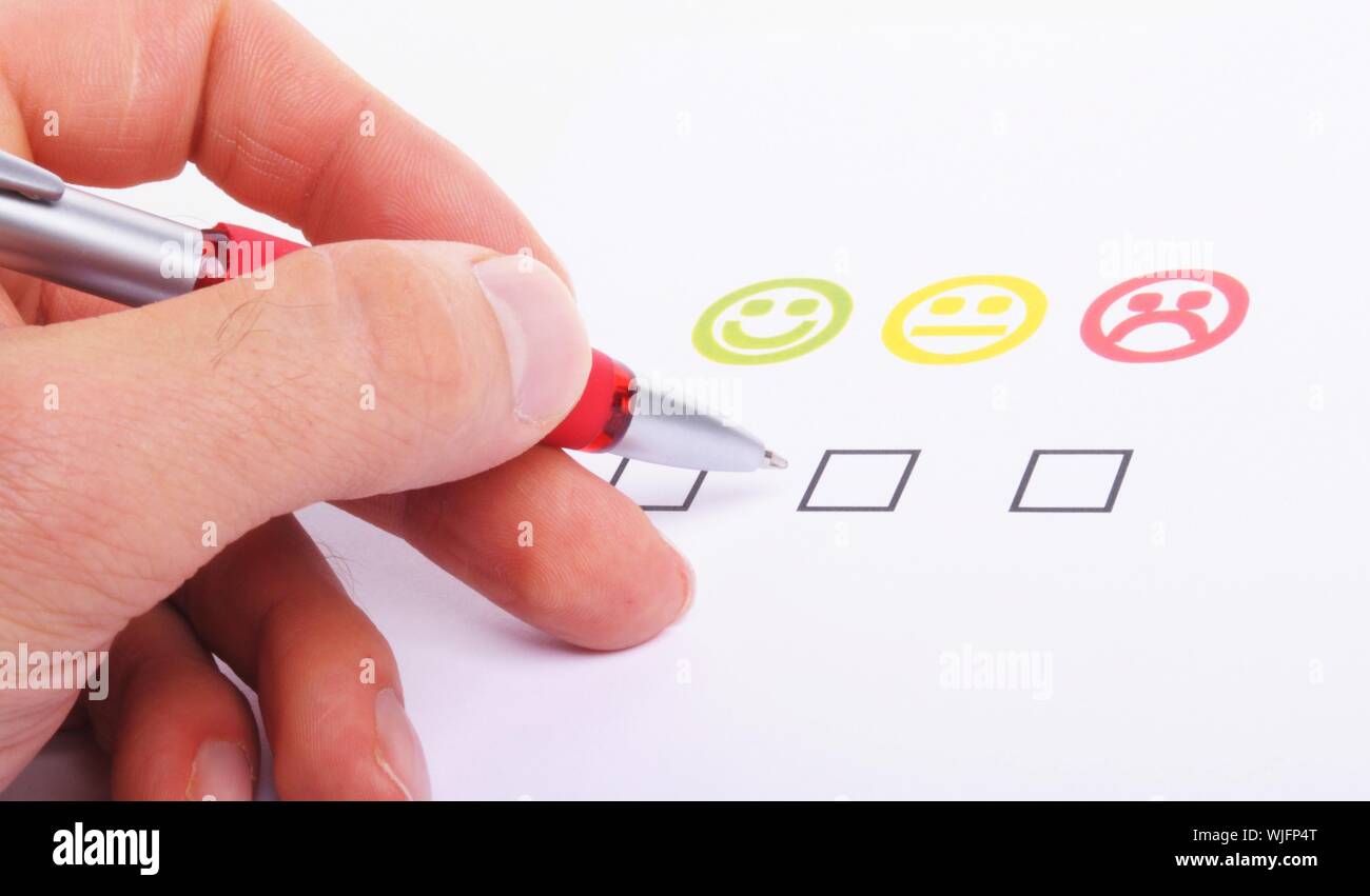 hand pen and checkbox or tickbox with smilie Stock Photo - Alamy