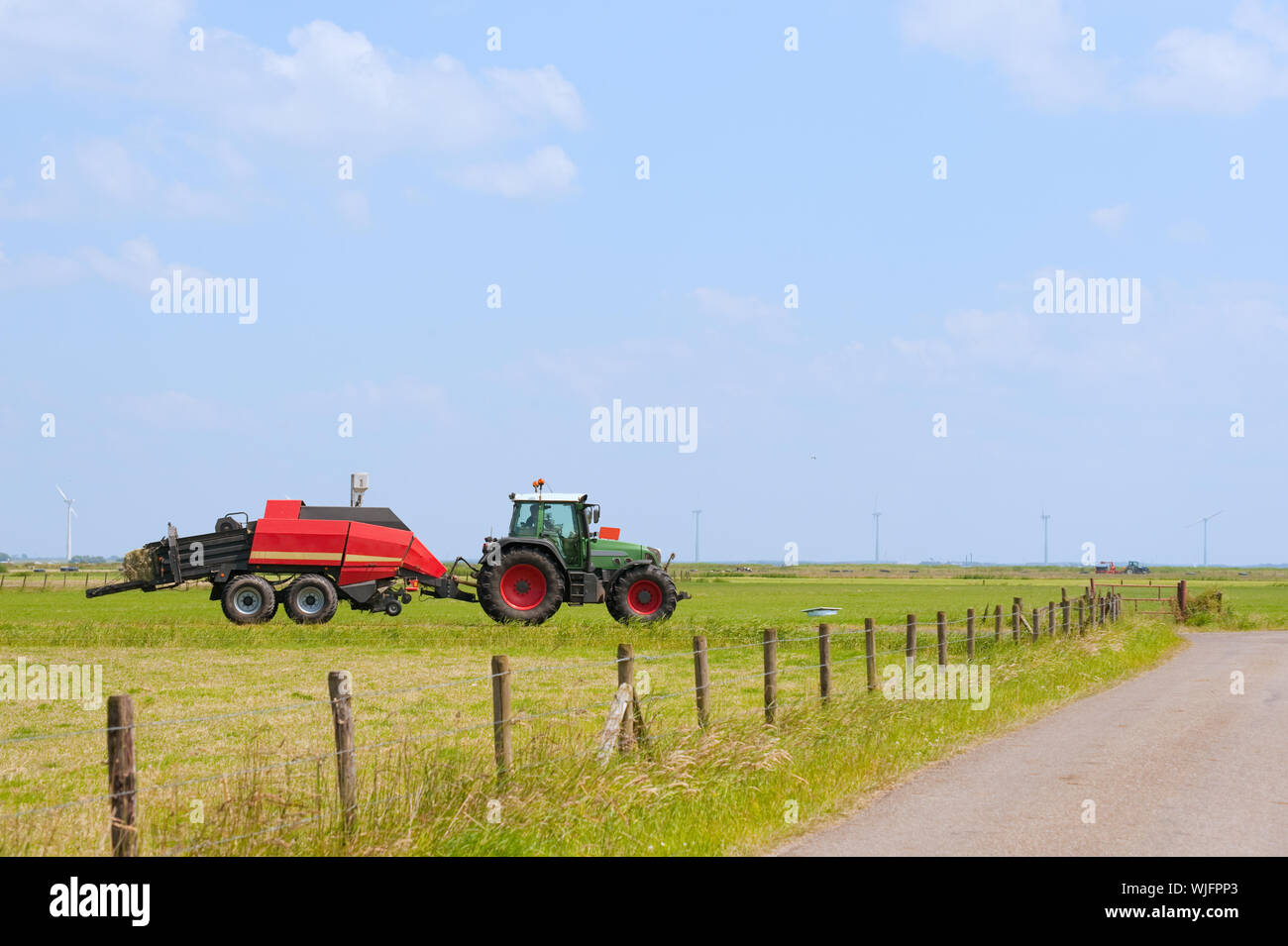 Typical Dutch landscape with tractor and farmland Stock Photo - Alamy