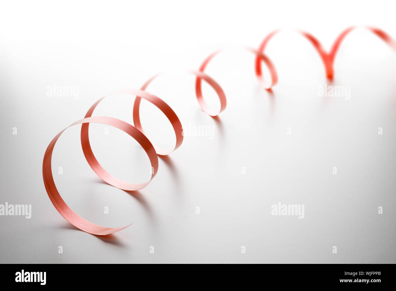 Image of a red package tape on white background Stock Photo - Alamy