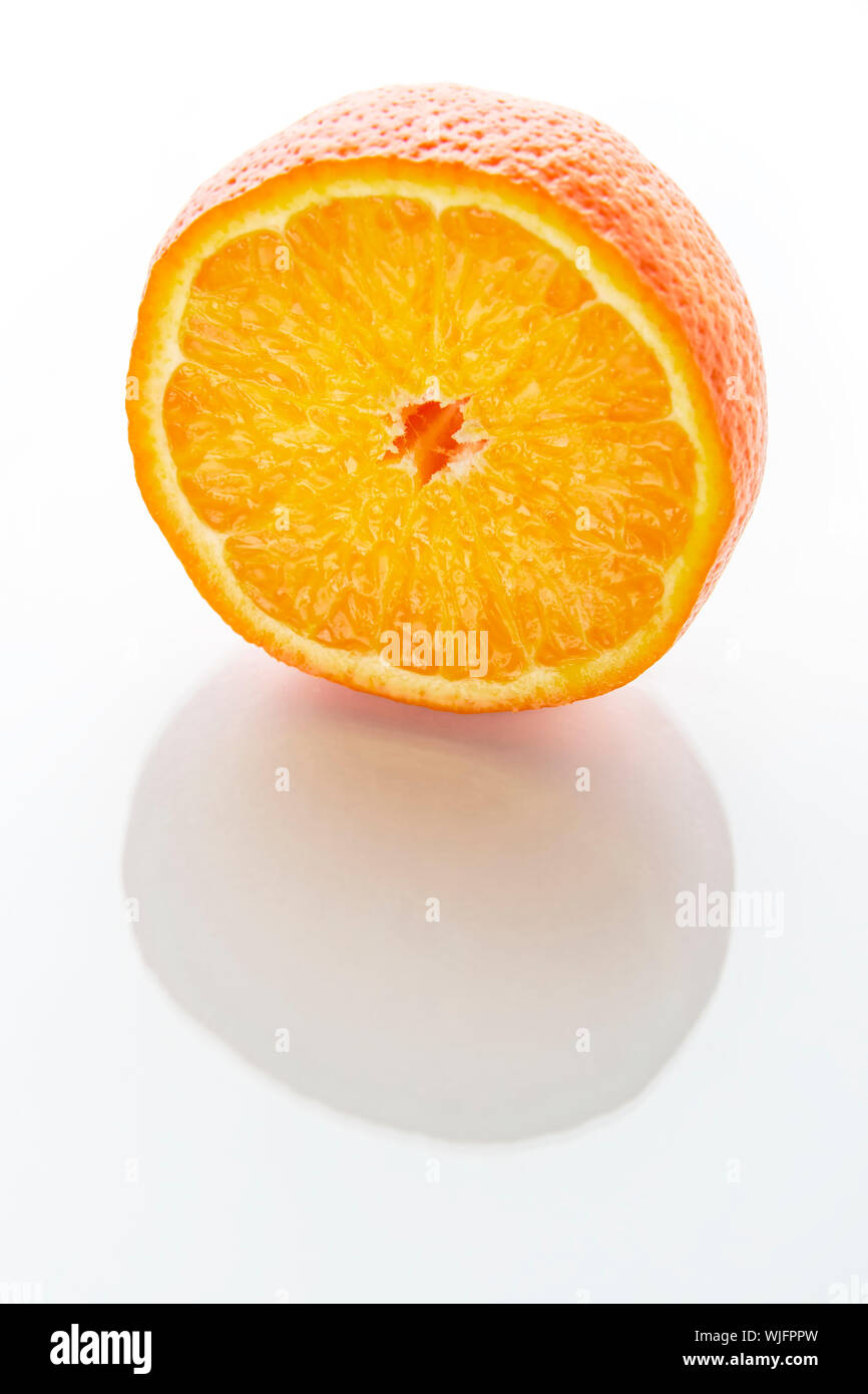 Image of a sliced orange on white background Stock Photo - Alamy