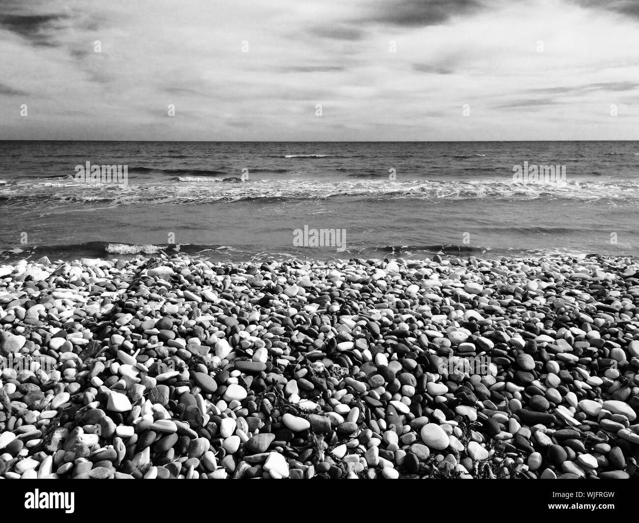 Pebble beach sea hi-res stock photography and images - Alamy