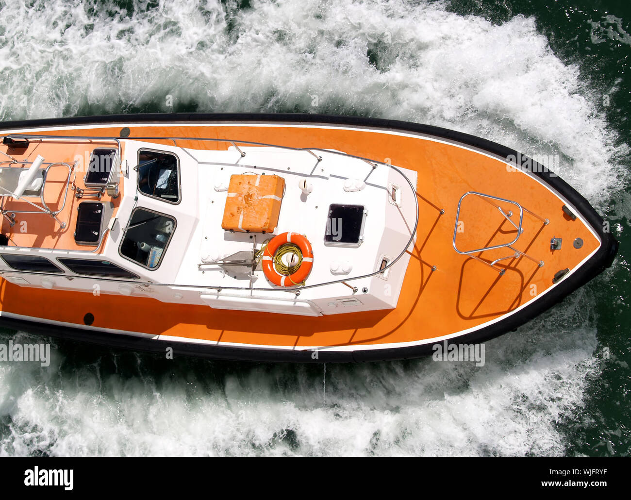 Pilot boat in action in Caribbean sea Stock Photo - Alamy