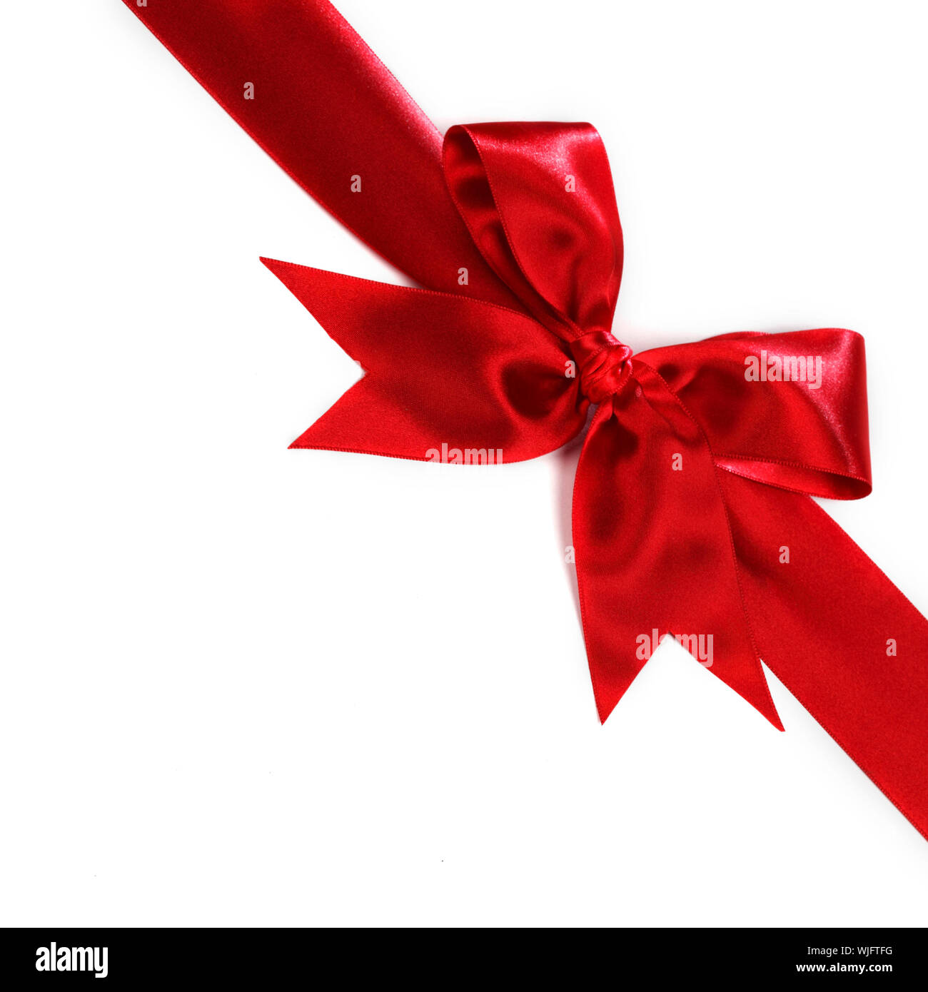 Shiny red satin bow isolated on white background Stock Photo - Alamy