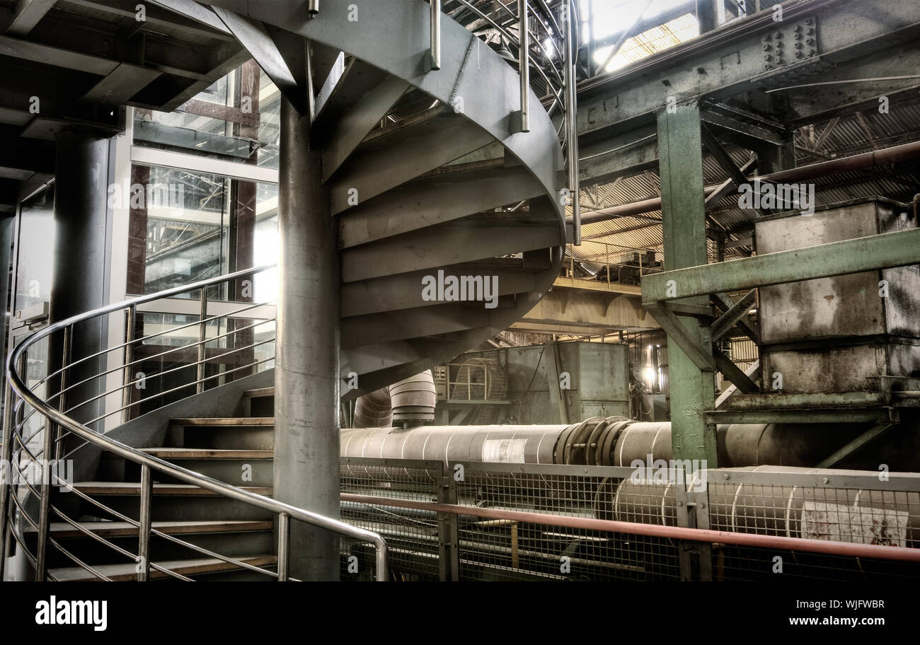 Metal staircase in abandoned factory hi-res stock photography and ...