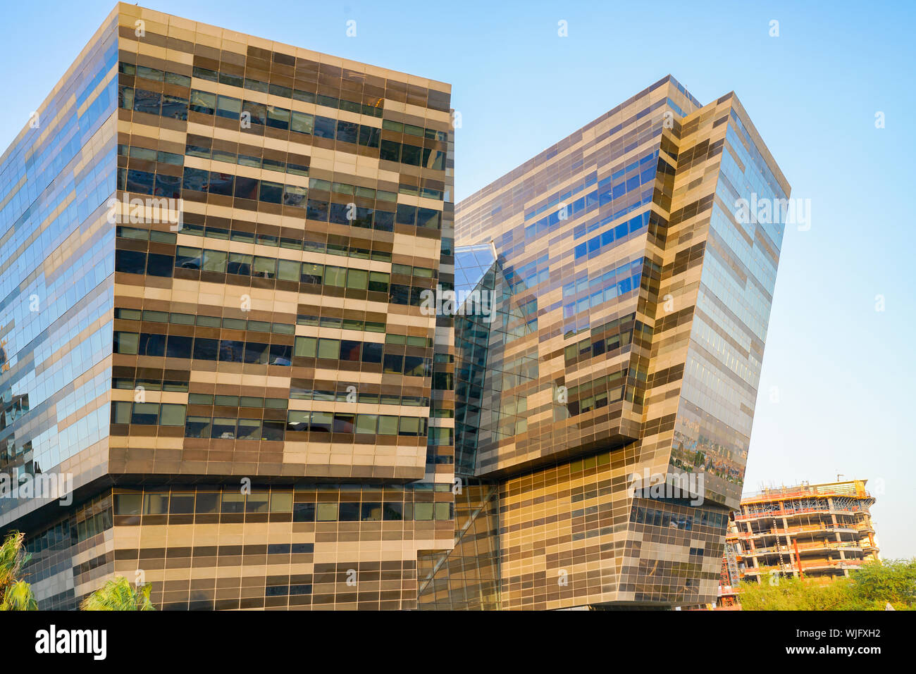 Al Hitmi, modern office building with striking glass facade with one ...