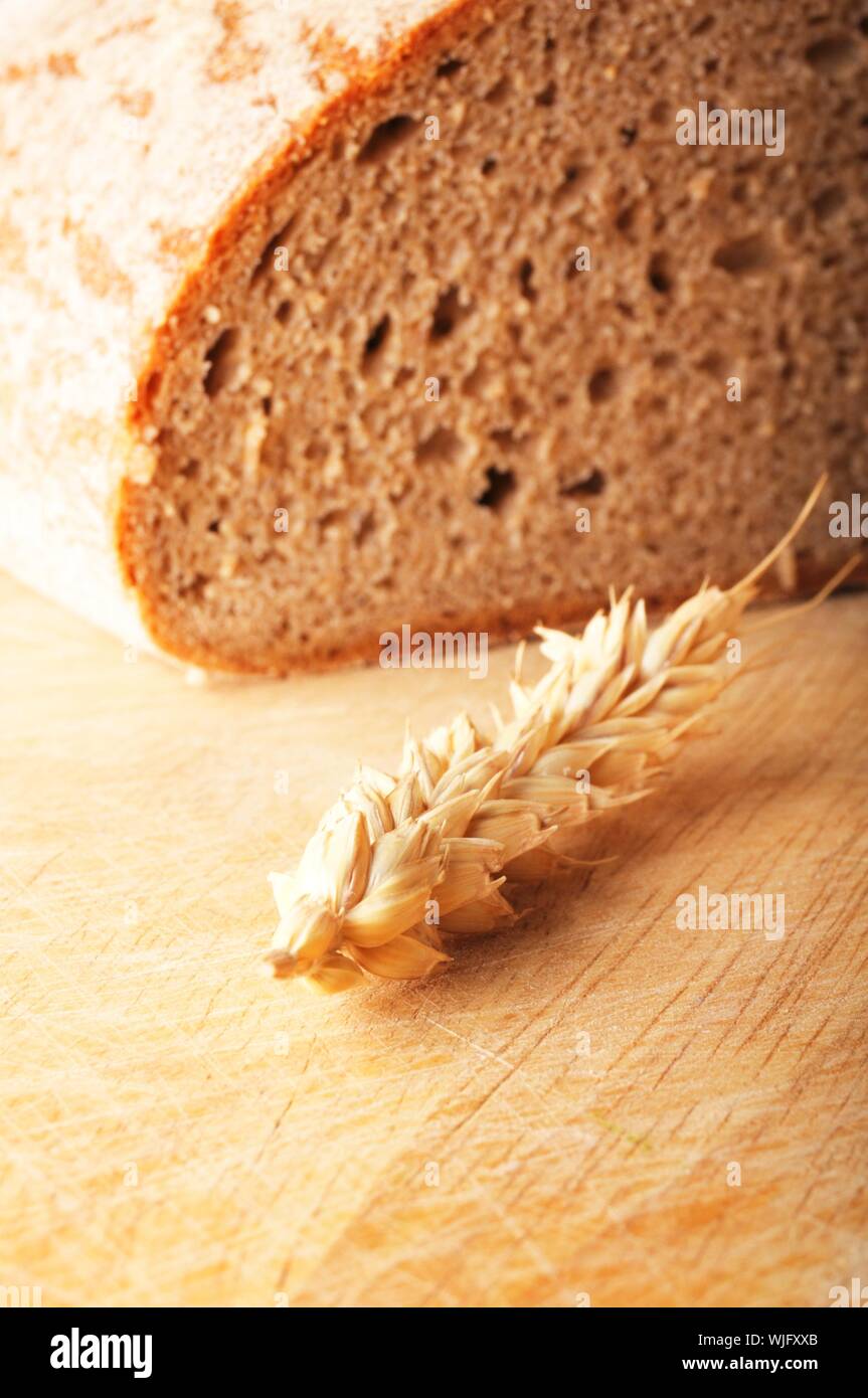 bread on wood surface showing food or bakery concept Stock Photo - Alamy