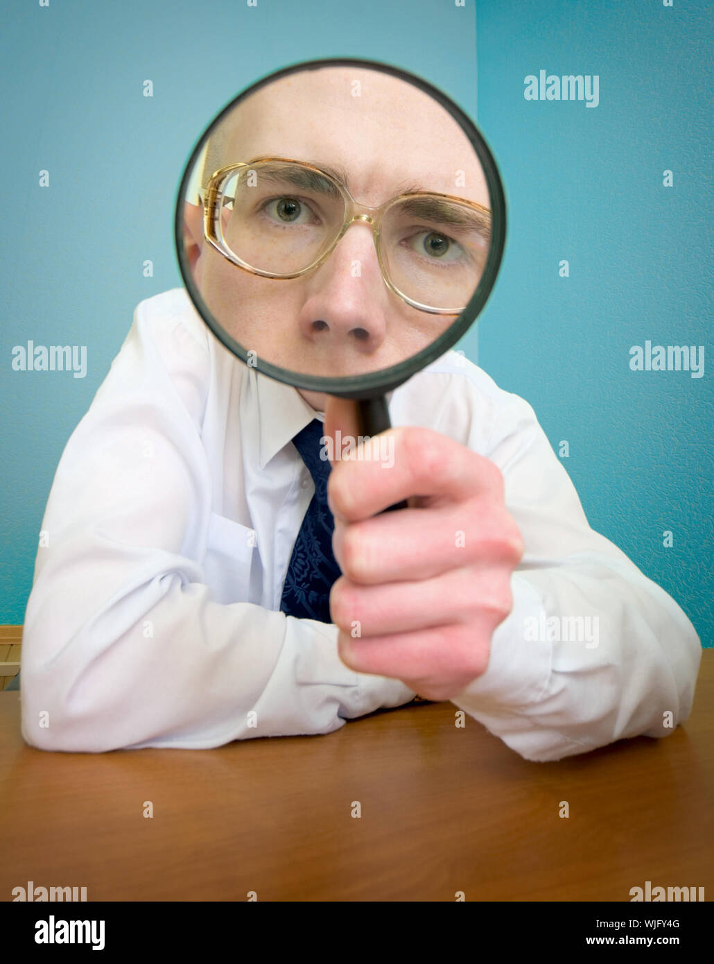 Funny people with a magnifier in a hand Stock Photo - Alamy