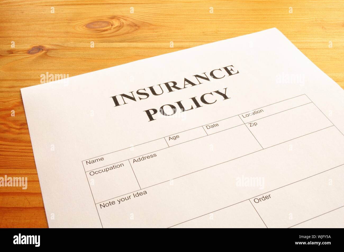 insurance policy form on desk in office showing risk concept Stock ...