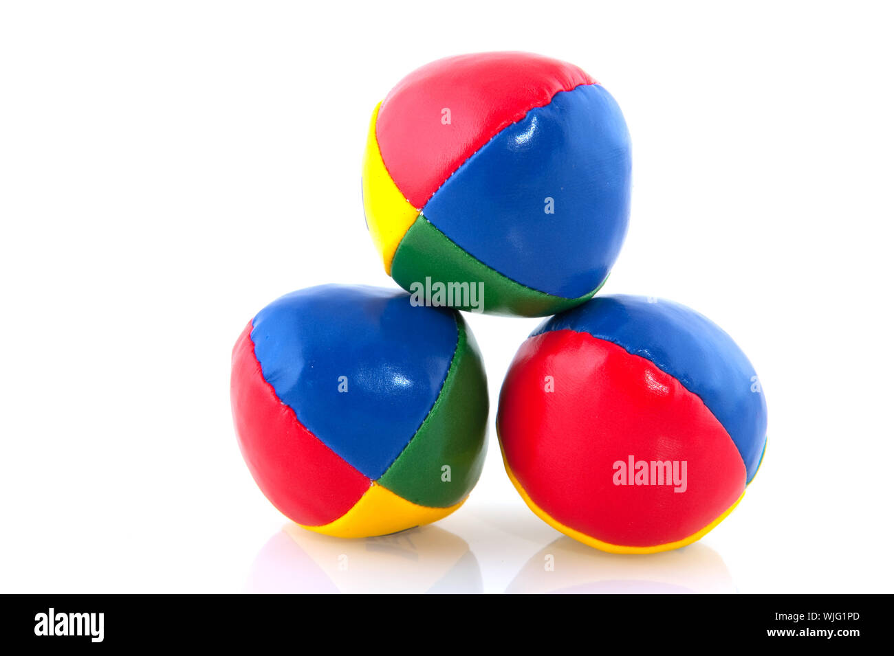 three colorul balls stacked isolated over white Stock Photo - Alamy