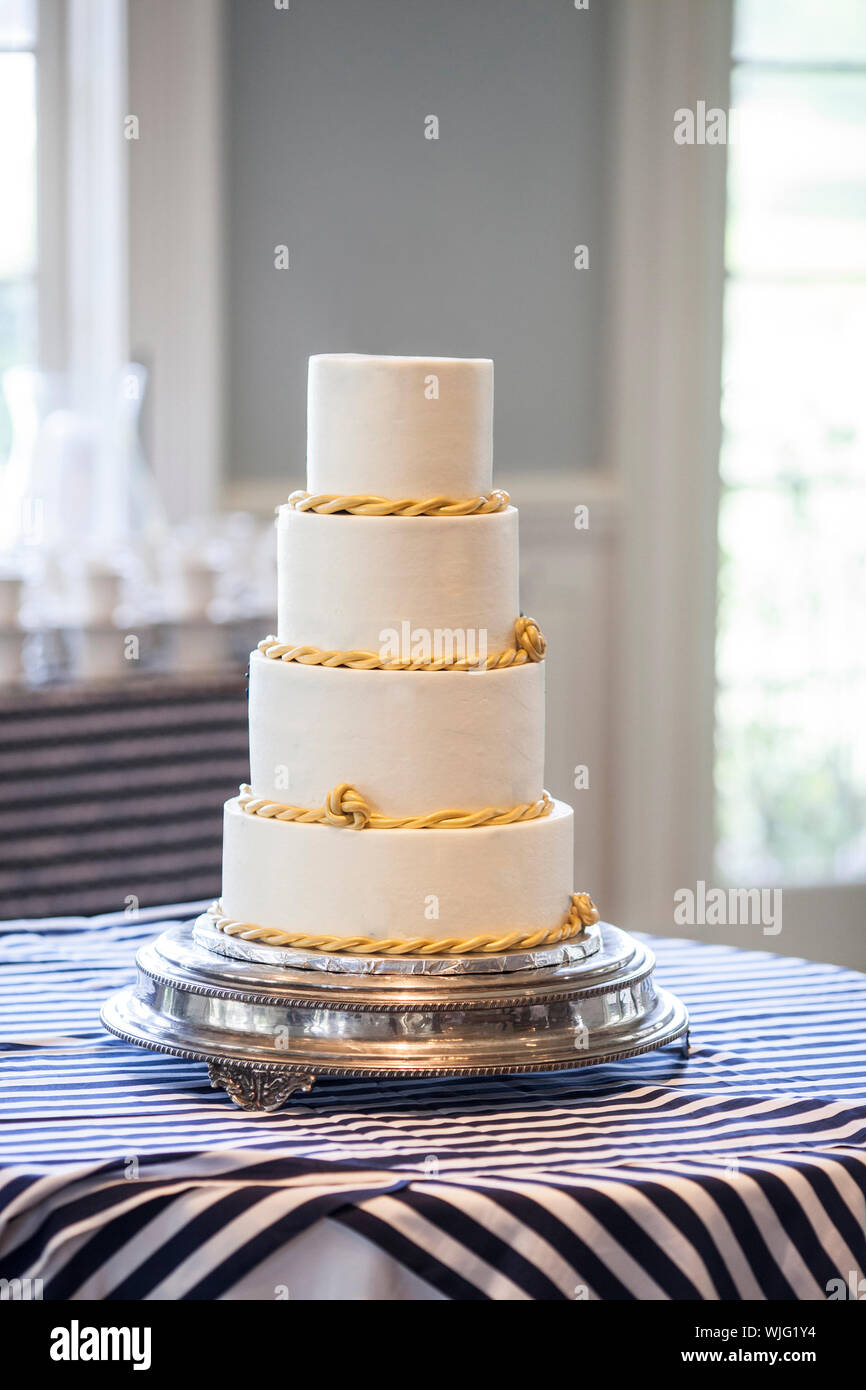 Plain four tiered wedding cake, place your own topper Stock Photo - Alamy