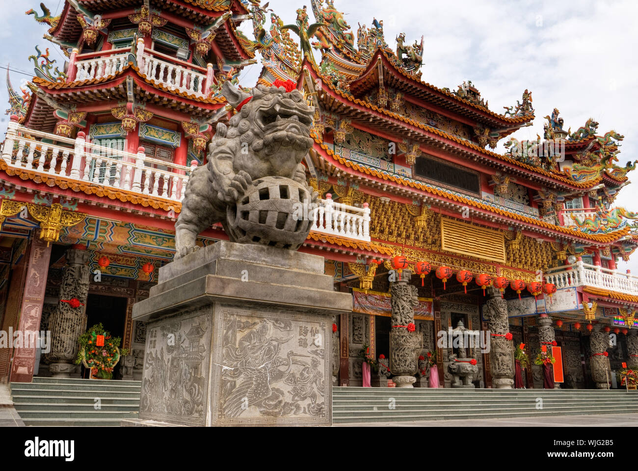 Color building of classic religious temple of China with lion carving ...