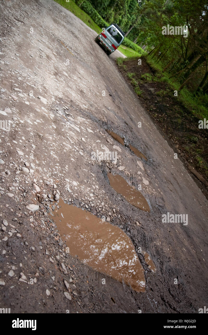 Famous Costa Rica potholes on rugged dirt road Stock Photo - Alamy