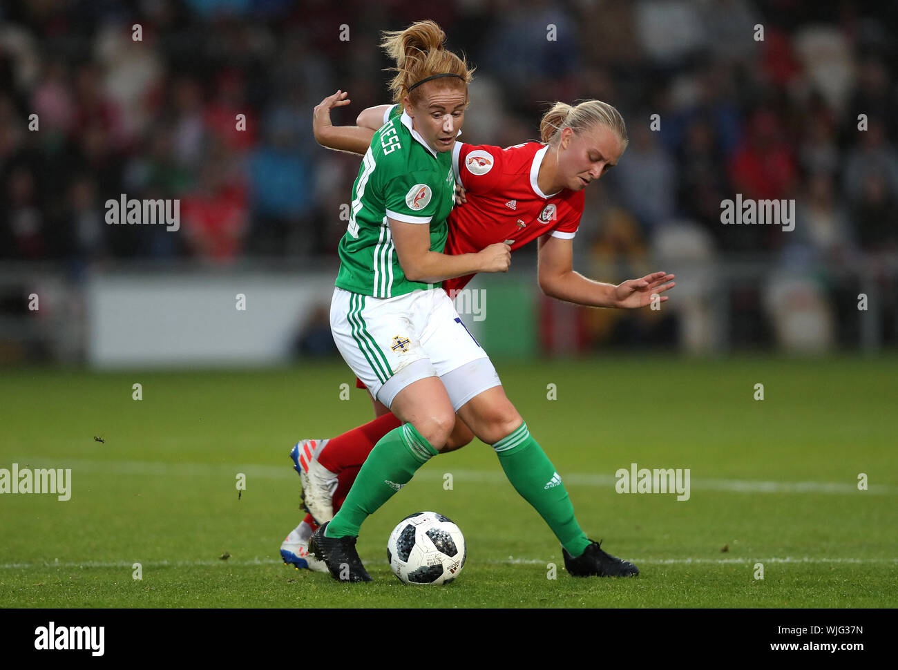Northern Ireland's Rachel Furness is challenged by Wales' Elise Hughes ...