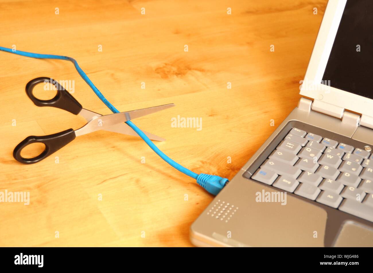 wireless lan or internet connection concept with laptop cable and ...